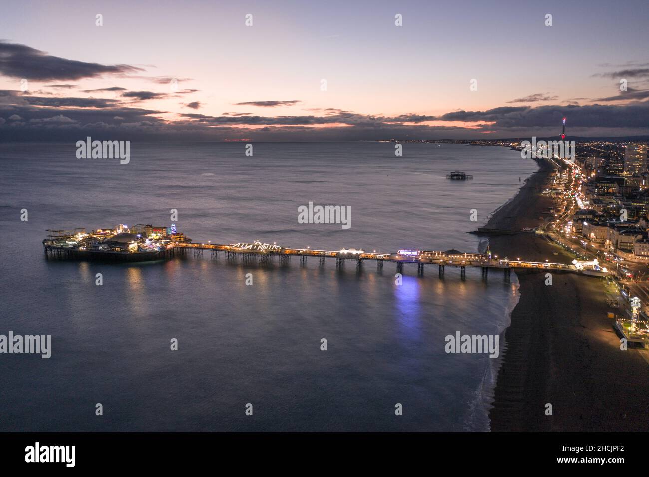 The Seafront Palace Pier in Brighton Illuminated at Night Aerial View ...