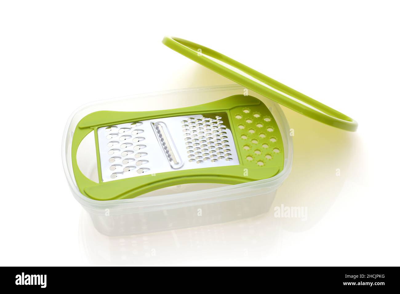 vegetable cutter and slicer with metal blades on a white background ...