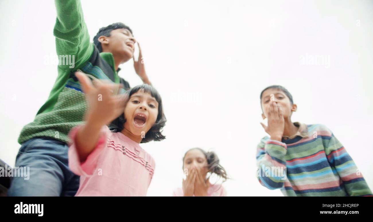 Group of young cute Indian kids playing and sending kisses to the ...