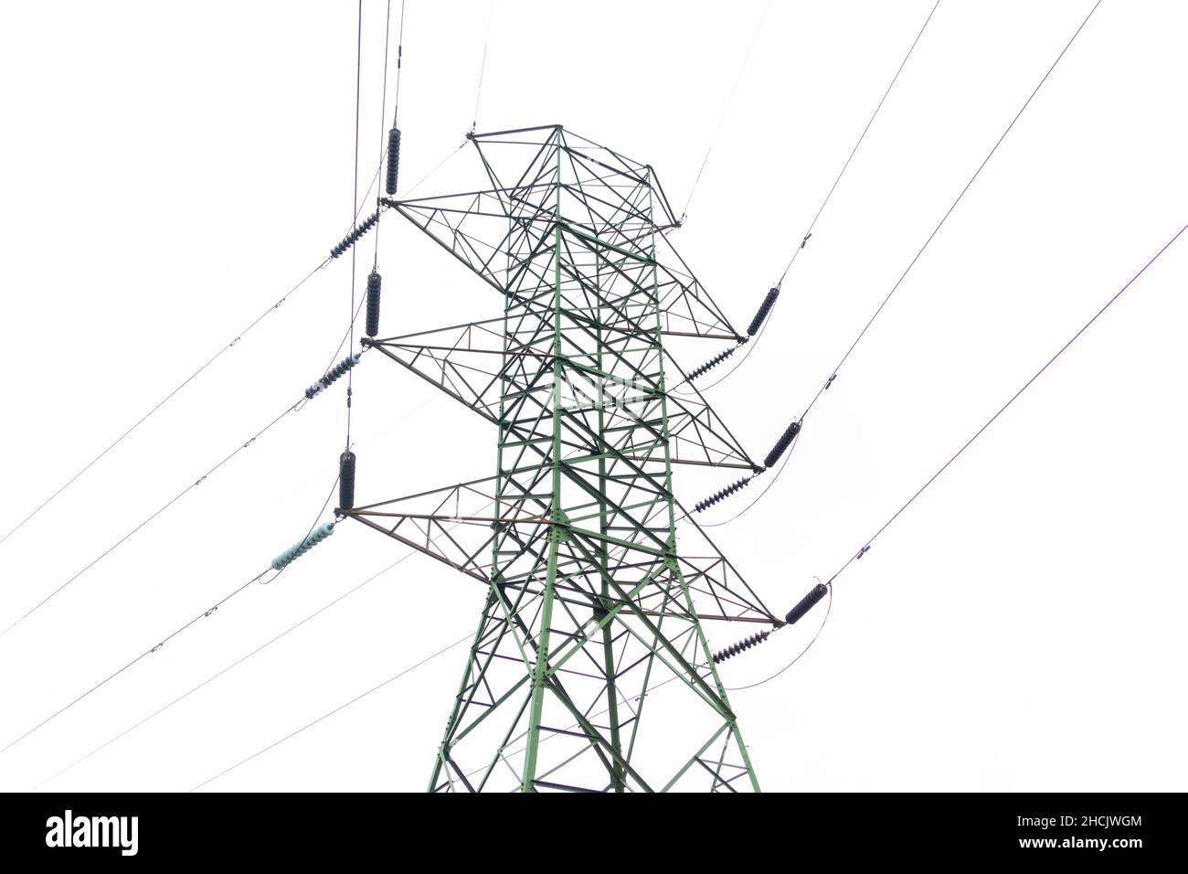 Photograph of a large steel electrical transmission tower near a dirt ...