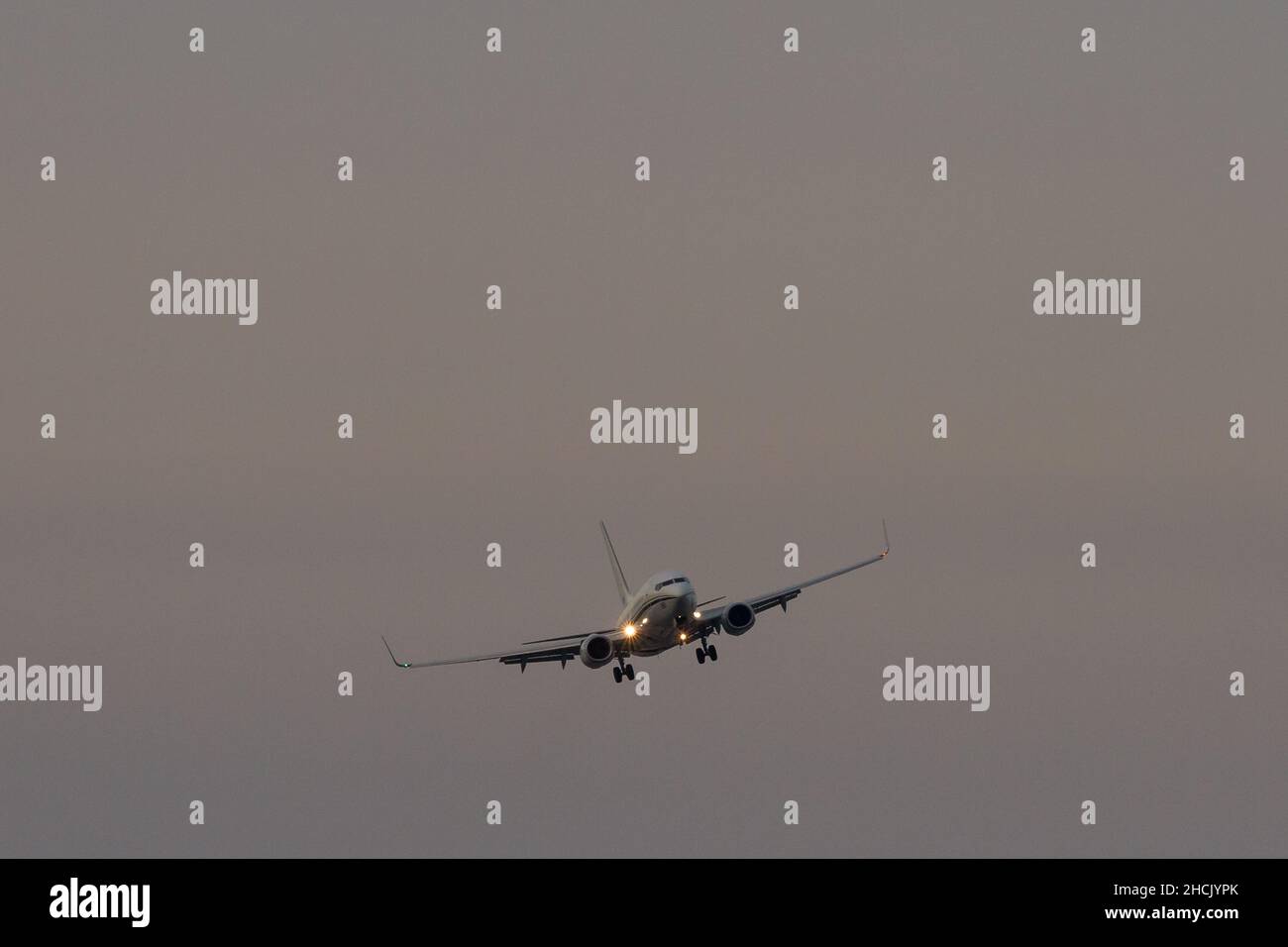 A US Navy Boeing C40A Clipper military transport aircraft flying near ...