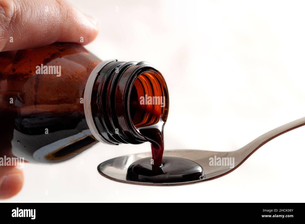 Hand pouring syrup hi-res stock photography and images - Alamy