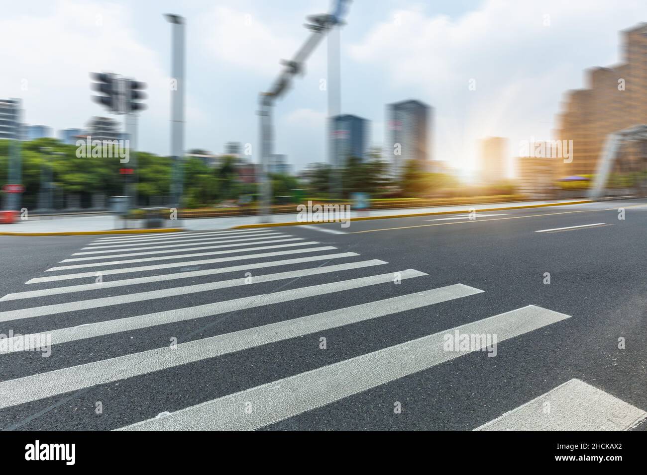 empty road with zebra crossing and skyscrapers in modern city Stock ...