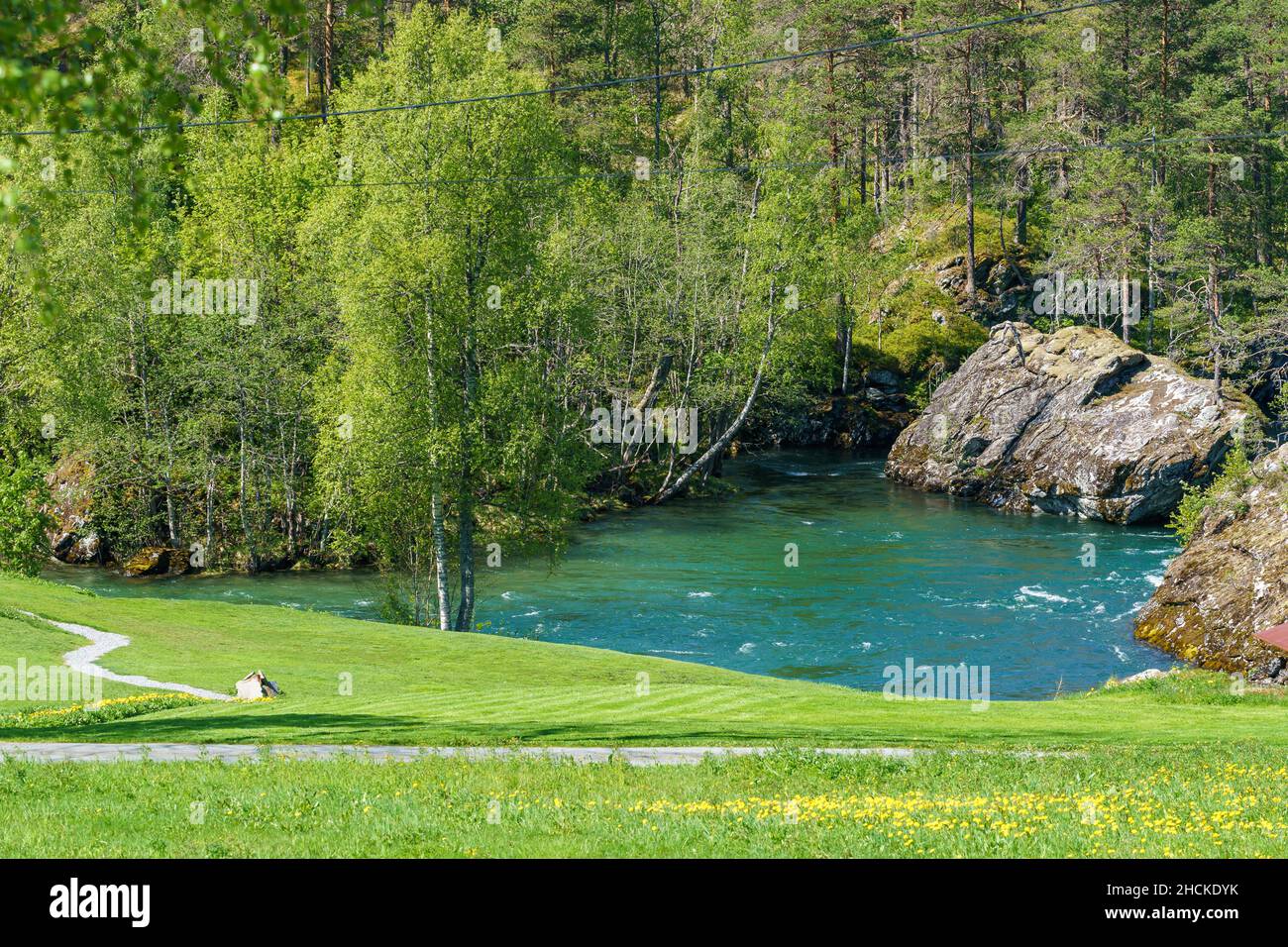 VALLDAL, NORWAY - 2020 MAY 31. Beautiful green river going through the ...