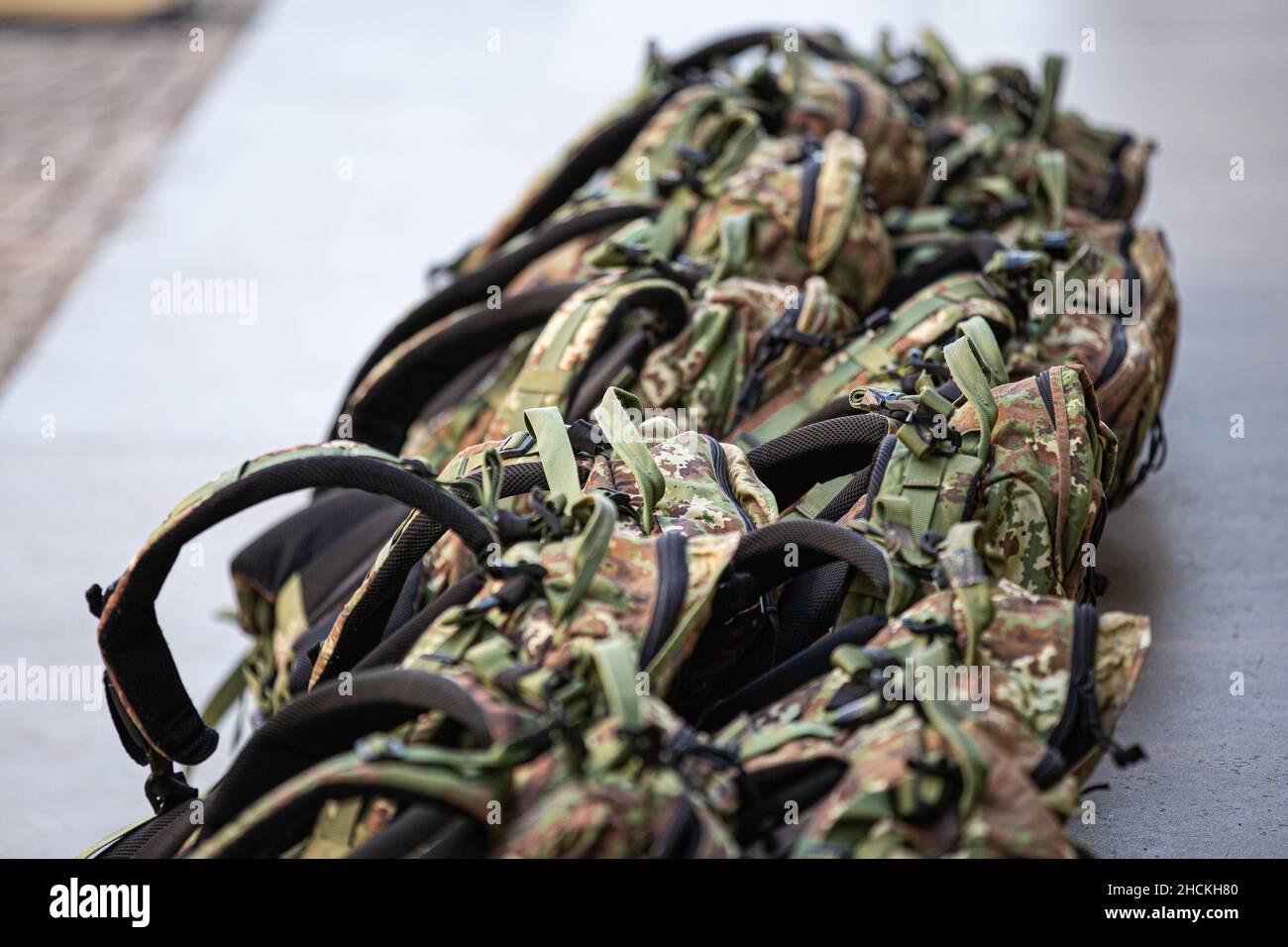 Set of Military Backpacks side by side in Line on the Ground Stock ...