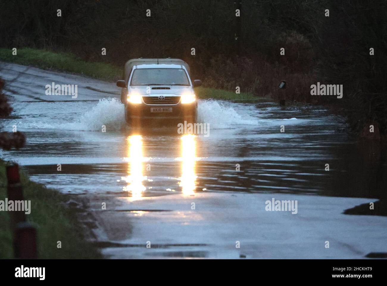 Sutton Gault, UK. 28th Dec, 2021. A van just manages to get through the ...