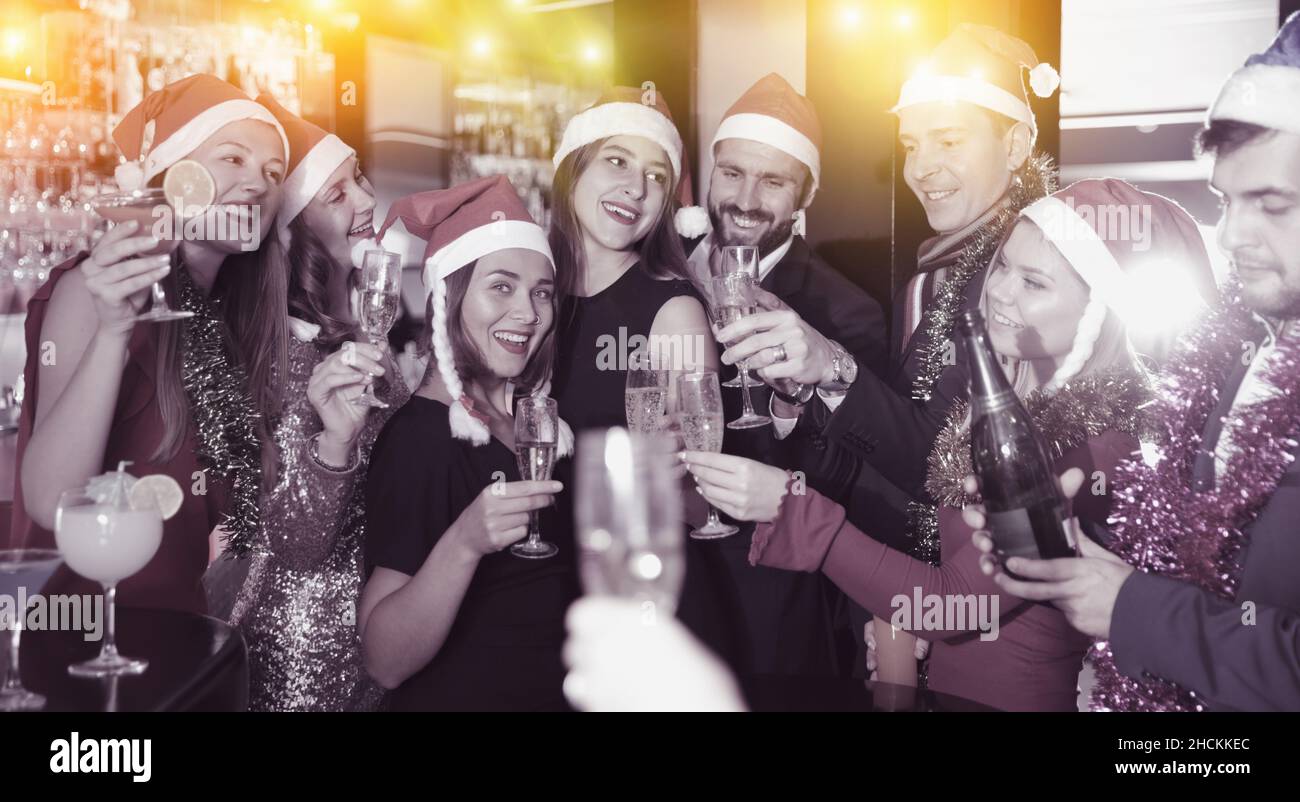 Friendly collective on corporate new year party in bar Stock Photo - Alamy