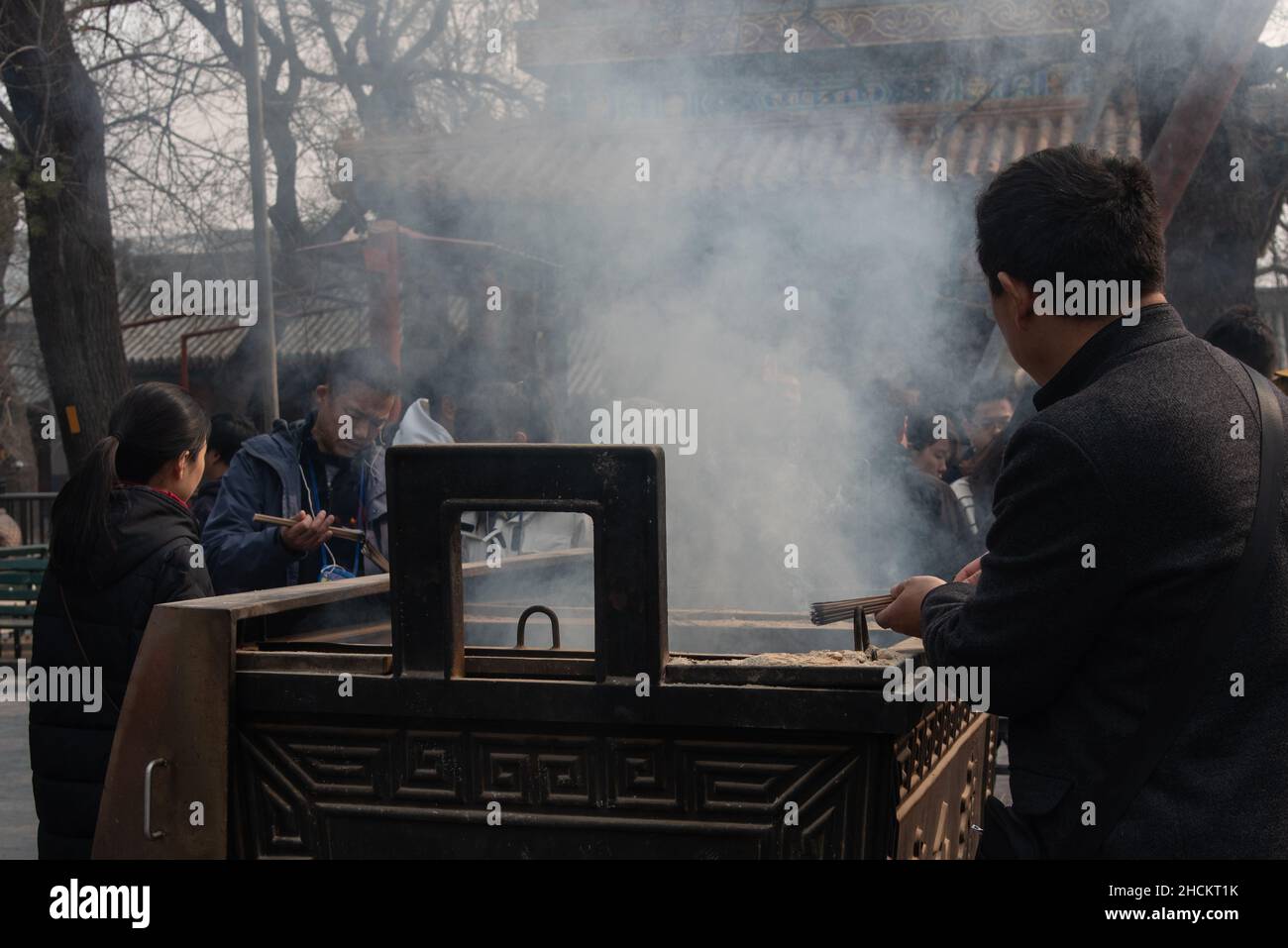 People praying at The Lama Temple Stock Photo - Alamy