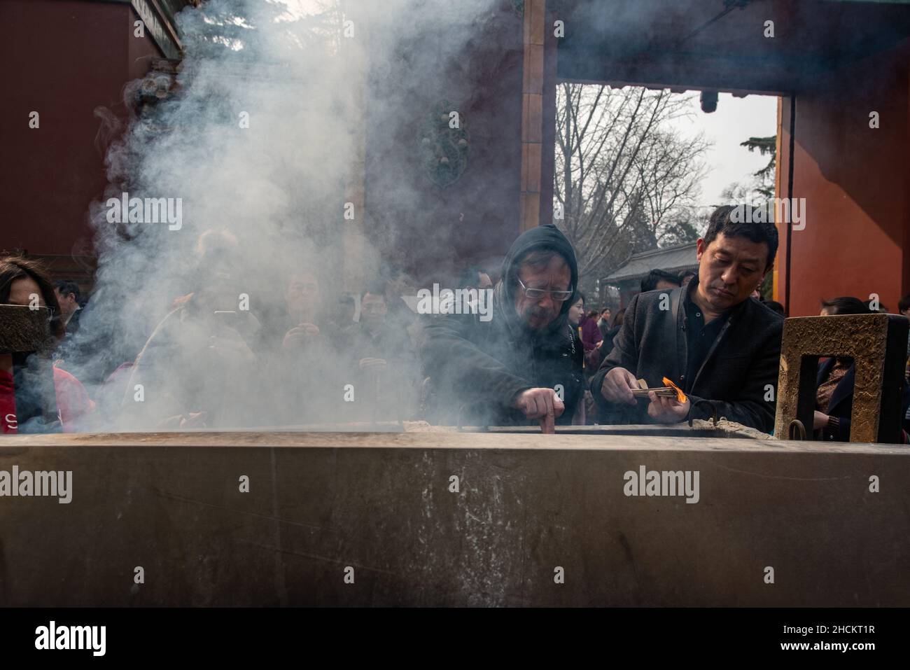 People praying at The Lama Temple Stock Photo - Alamy