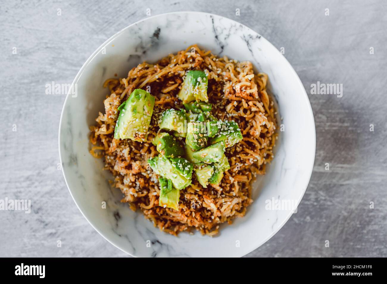 vegan ginger noodles with avocado sesame and fried onion topping ...