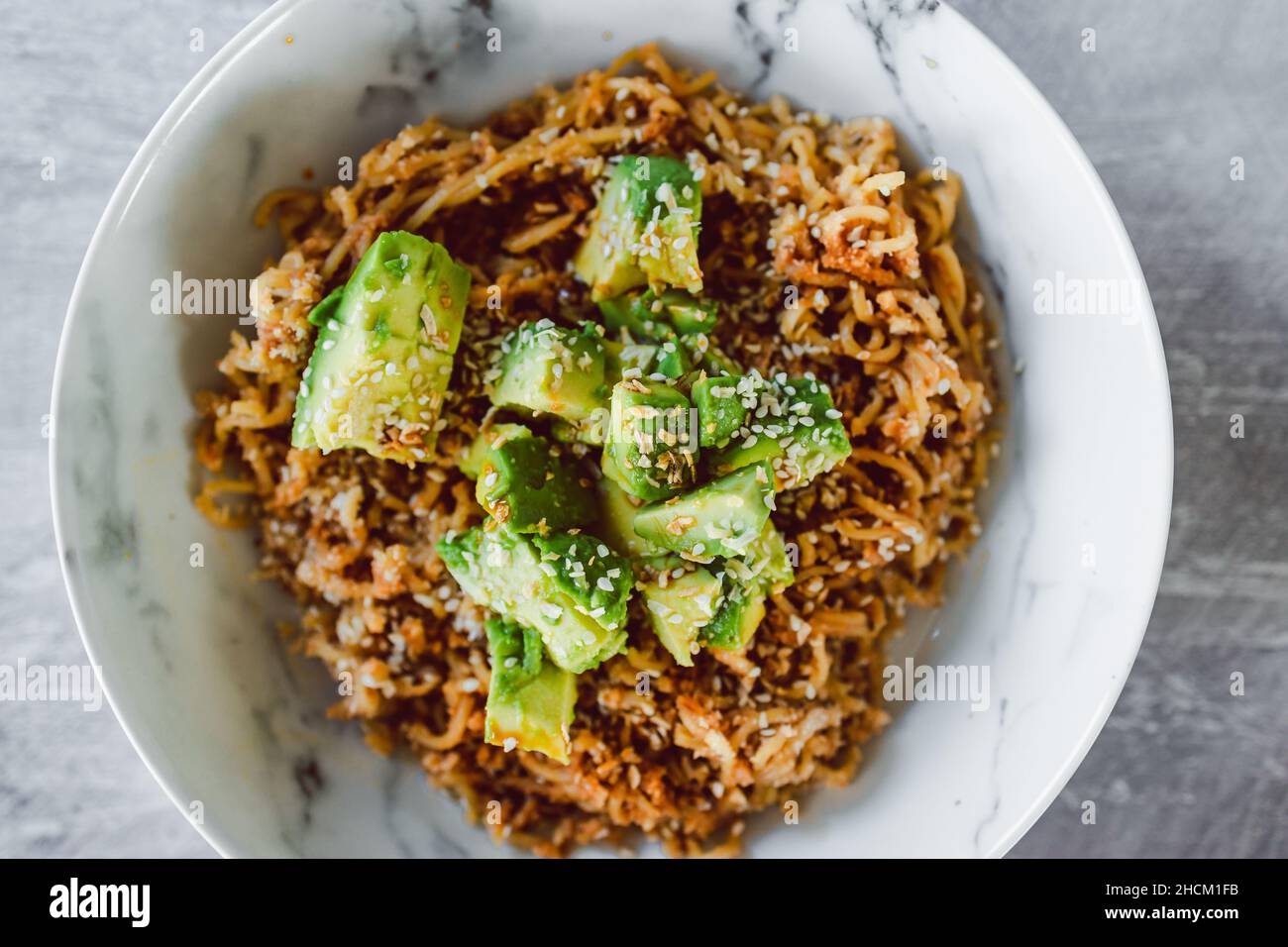 vegan ginger noodles with avocado sesame and fried onion topping ...