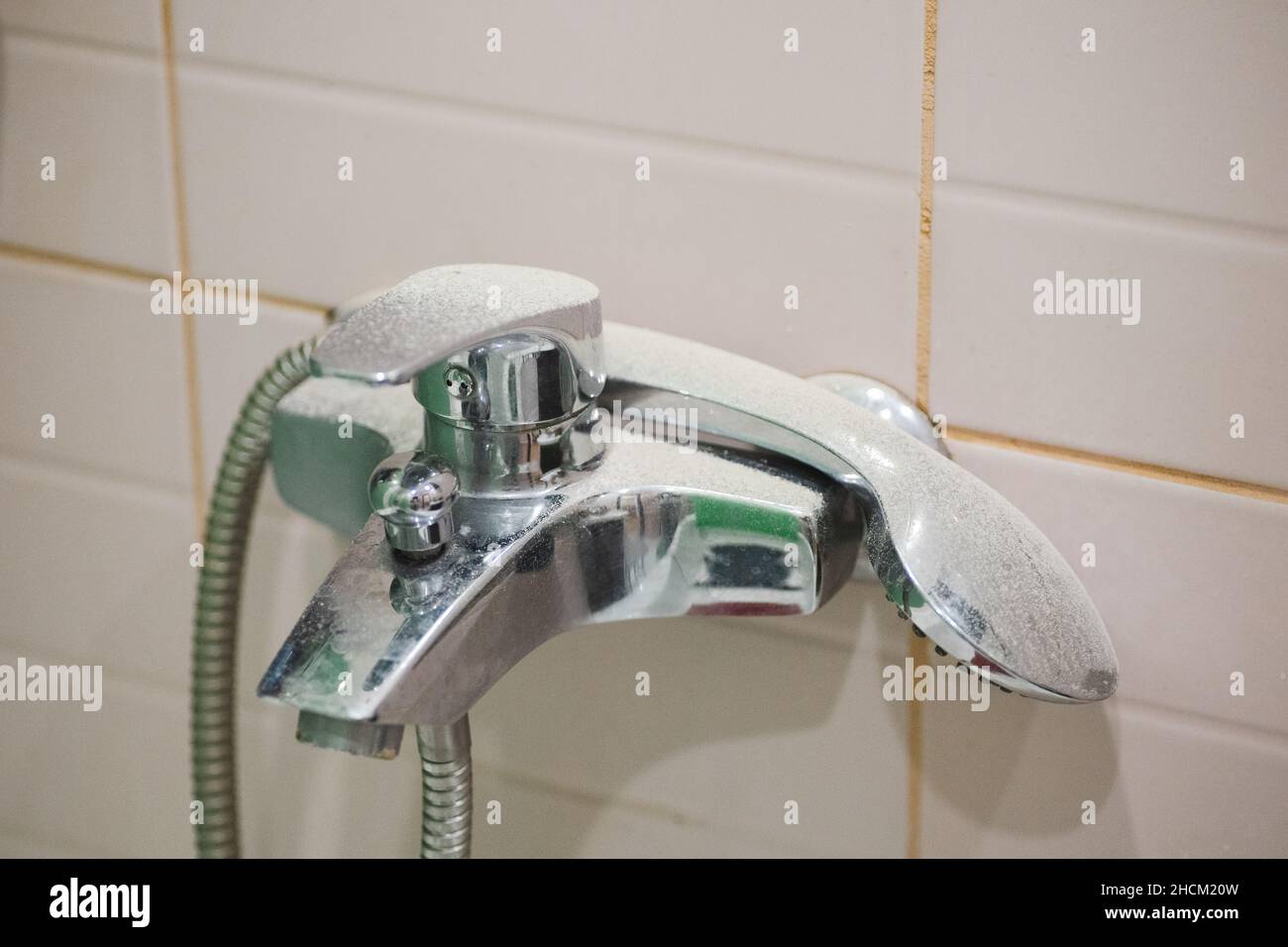 Dirt and dust on faucet and shower head because of renovation works in ...