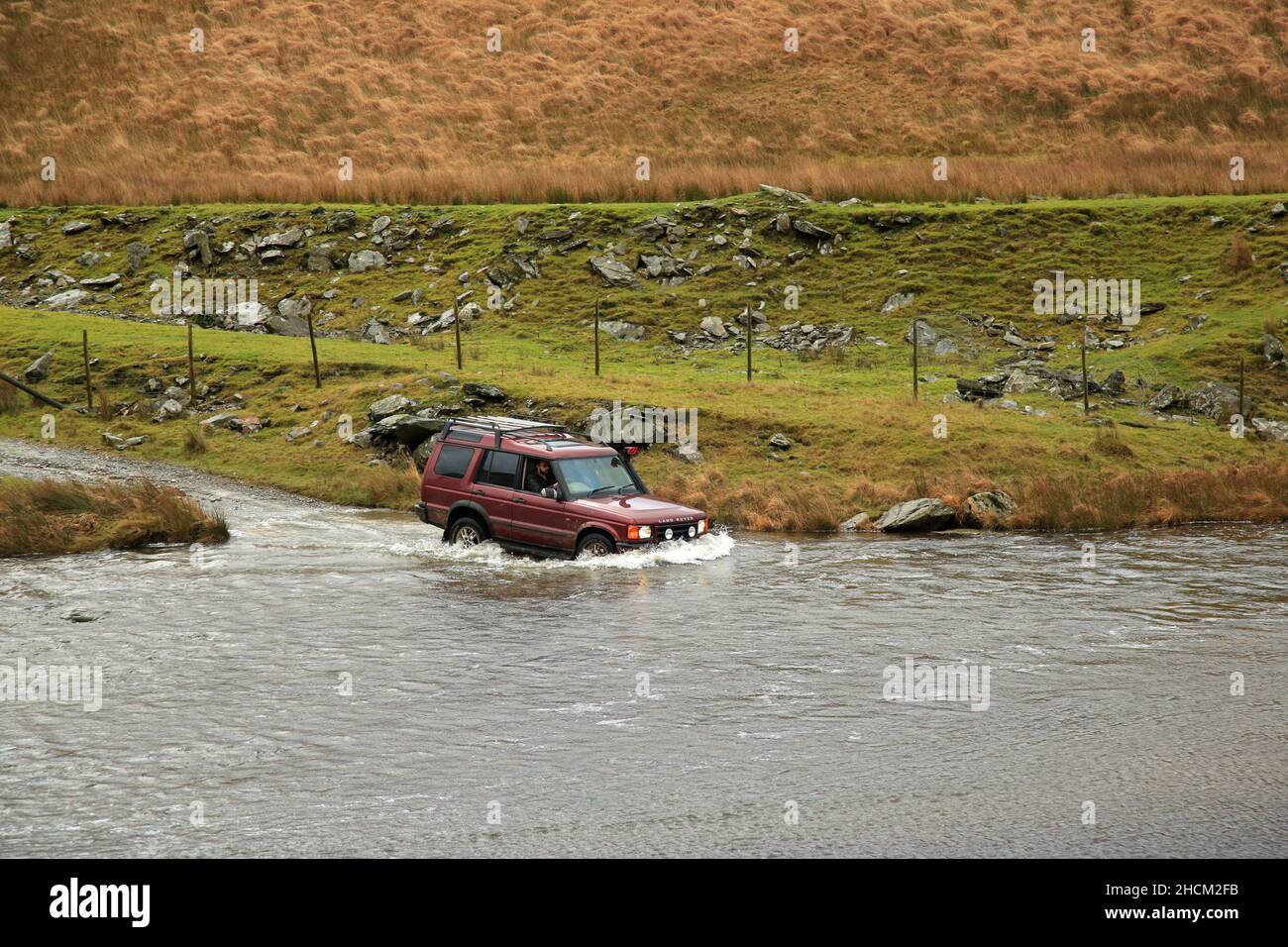 Vehicle driving through water hi-res stock photography and images - Alamy