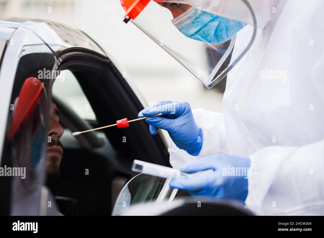Medical worker wearing protective PPE surgical gloves and clothing ...