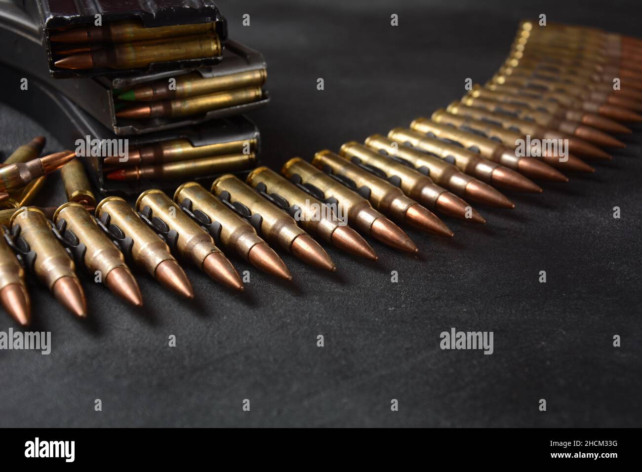 Photo of 5.56mm NATO Ammunition, machine gun bullets belt, rifle ...