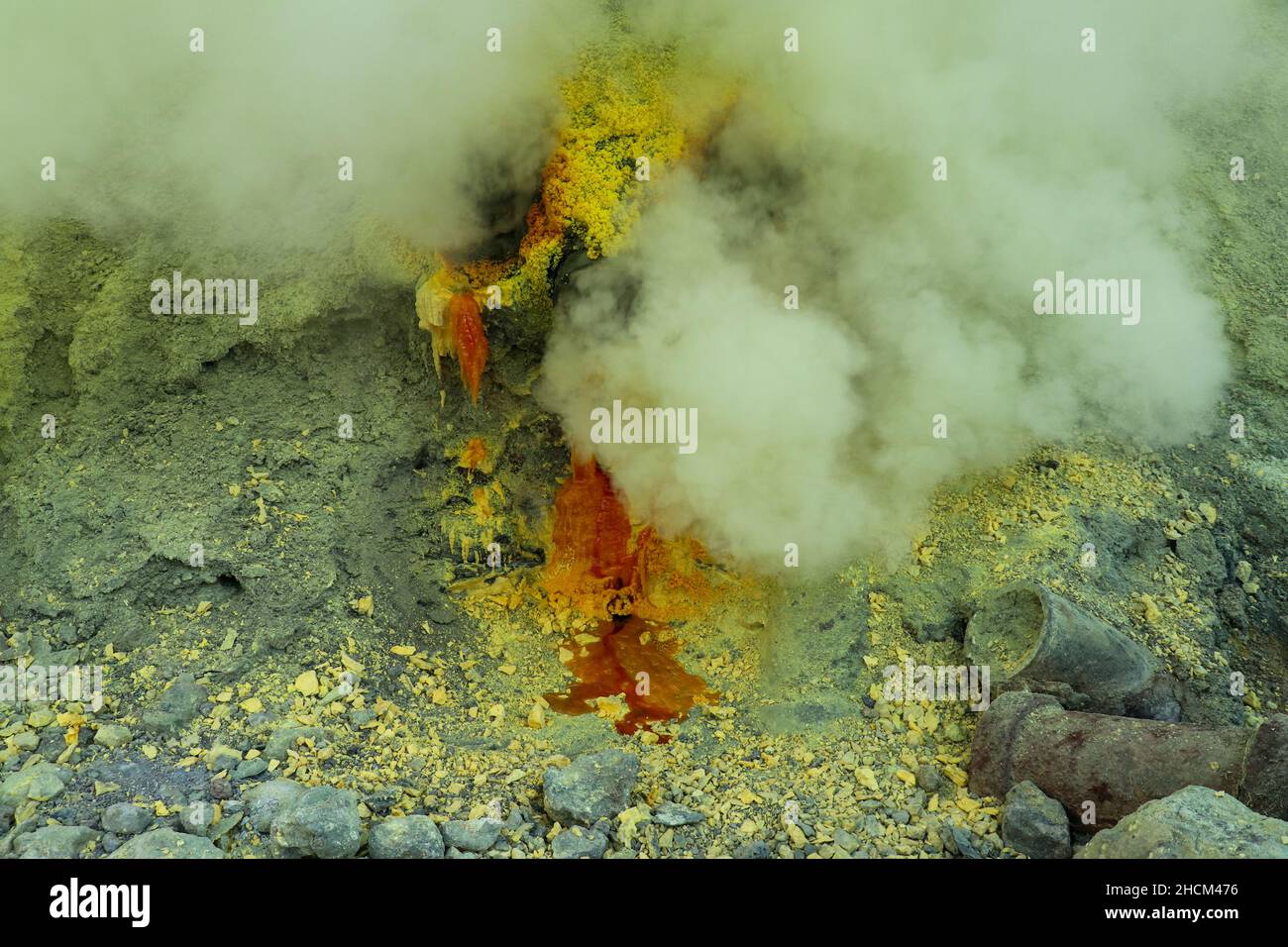 Molten sulfur dripping from pipes at Kawah Ijen volcano, East Java ...