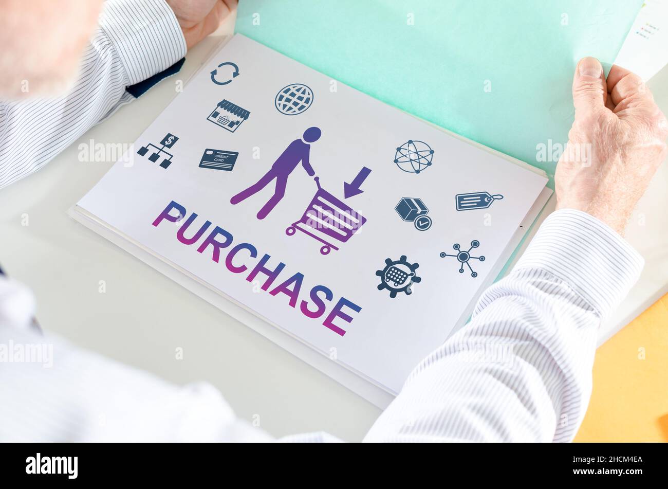 Man holding a file with purchase concept Stock Photo - Alamy