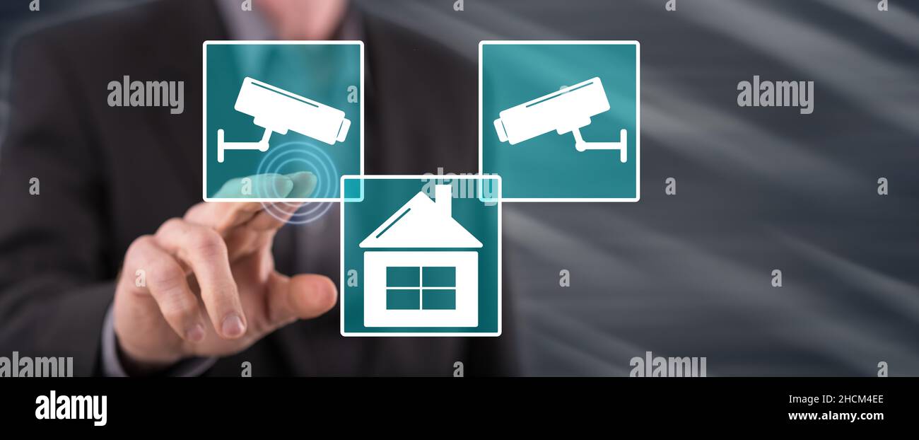 Man touching a security camera concept on a touch screen with his ...