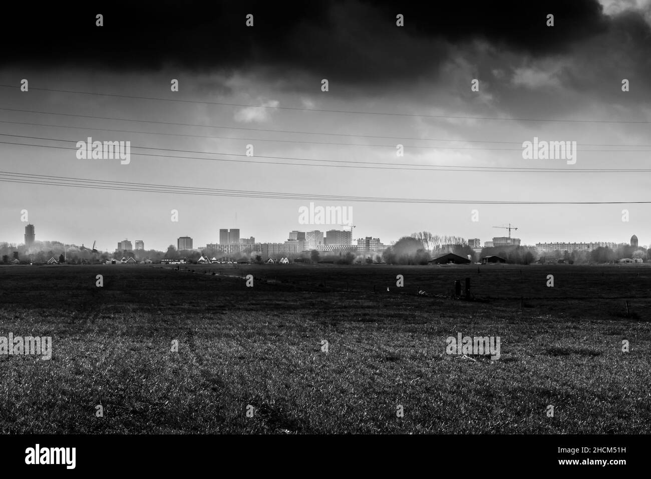 Cityscape in black and white with lots of clouds in gloomy weather ...