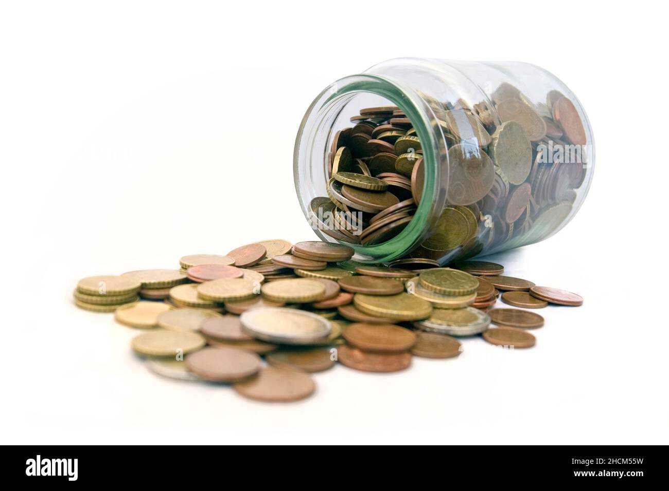 Coins Spilling from a Jar Stock Photo - Alamy