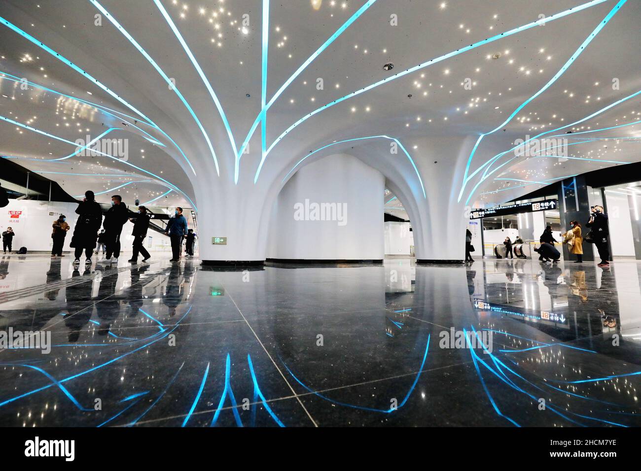 Shanghai. 30th Dec, 2021. Passengers transfer at Changyi Road Station ...