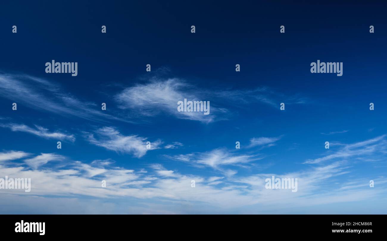 Blue clear sky with clouds Stock Photo - Alamy