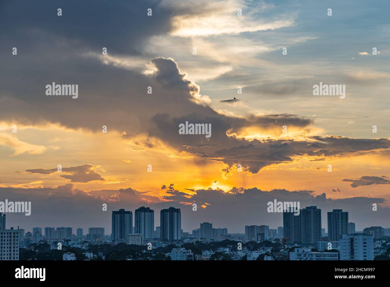 Beautiful sunset or sunrise sky in the golden hour with city background ...