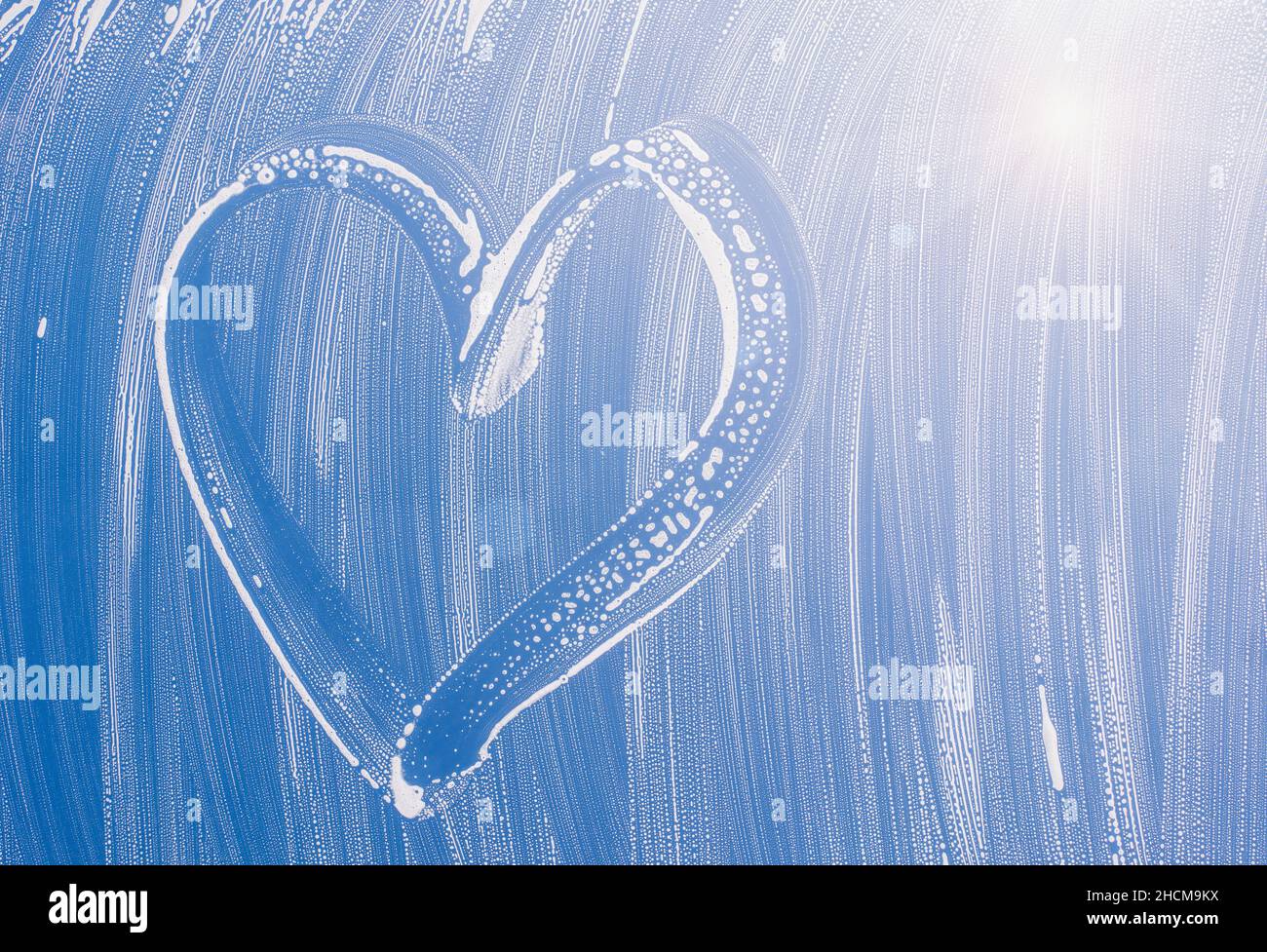 heart on window during cleaning the window Stock Photo - Alamy