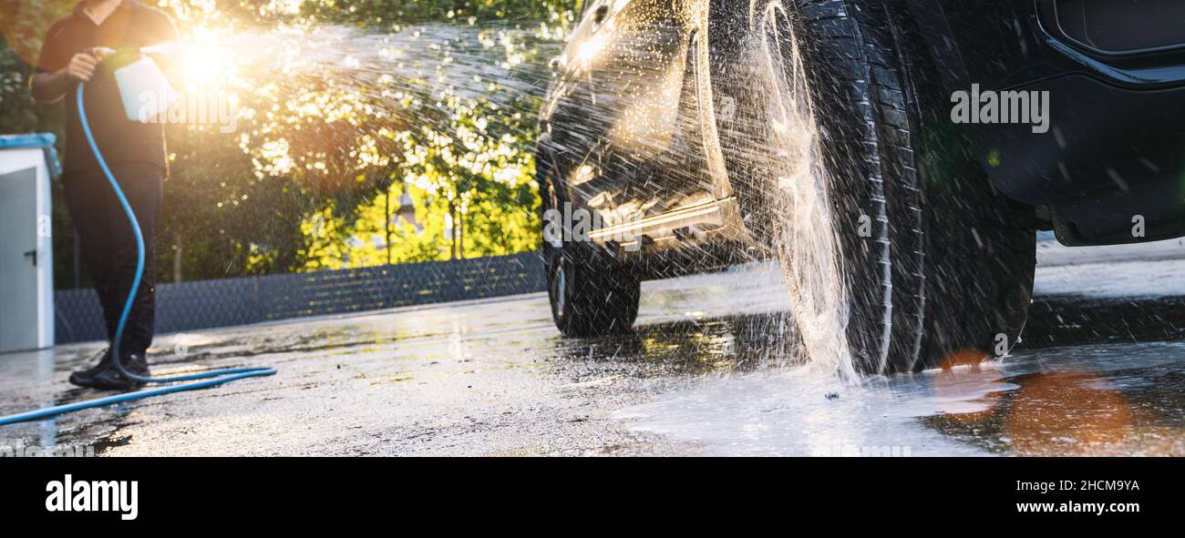 Car washing. Cleaning Car Using High Pressure Water at summer Stock ...
