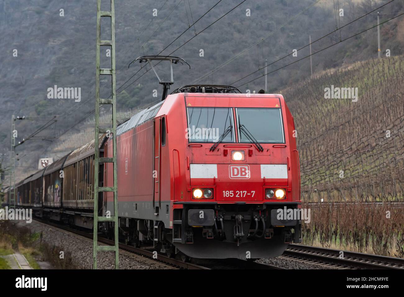 A freight train with a red electric locomotive Stock Photo - Alamy