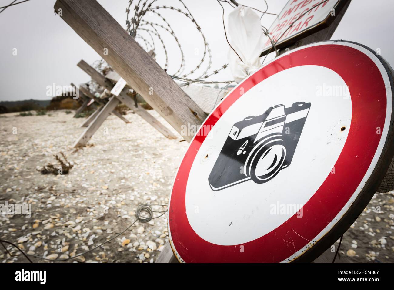 Sign illiustration of photo camera in red circle on the ground around ...