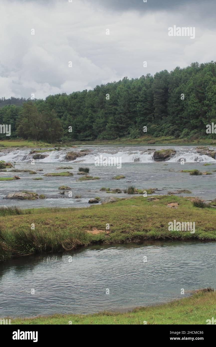pykara river and waterfalls on the foothills of nilgiri mountains near ...