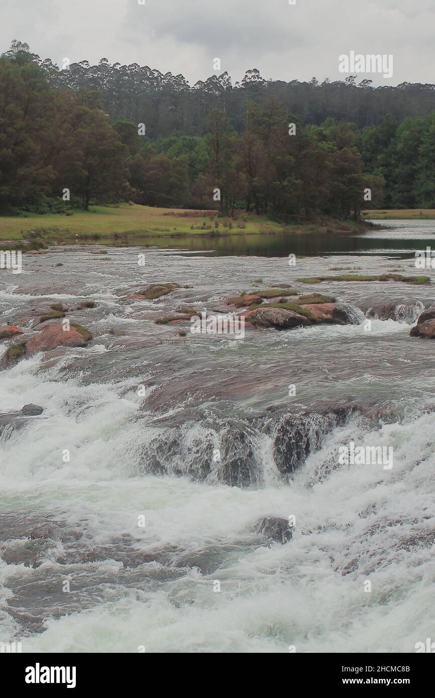 pykara river and waterfalls on the foothills of nilgiri mountains near ...