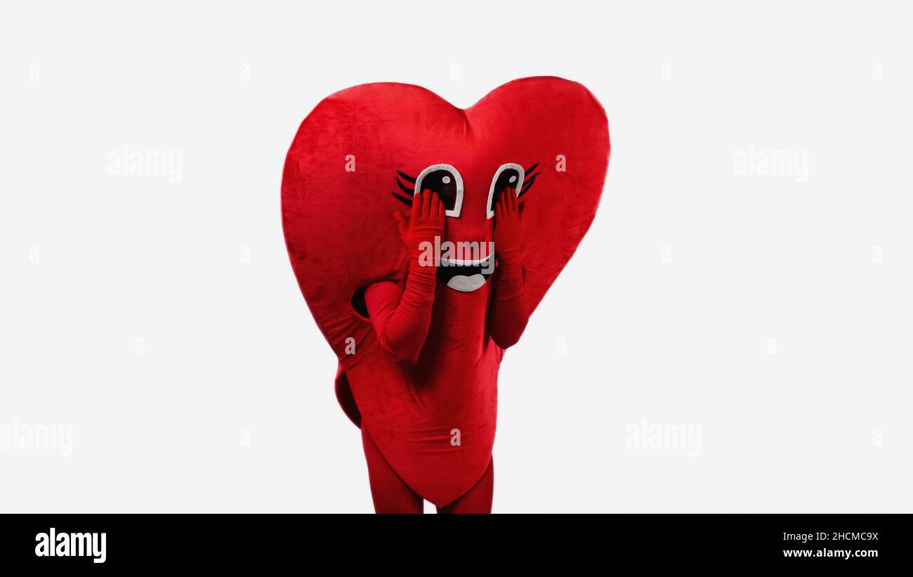 person in heart-shaped costume touching cartoon eyes while imitating ...