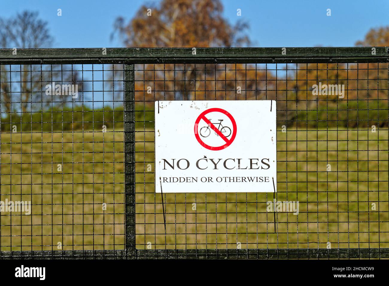 A No Cycling sign on a gate in Windsor Great Park, Berkshire England UK ...