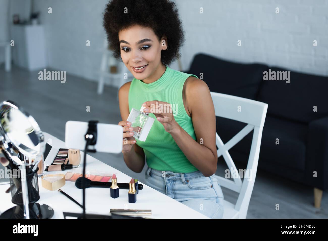 African american blogger holding hi-res stock photography and images ...