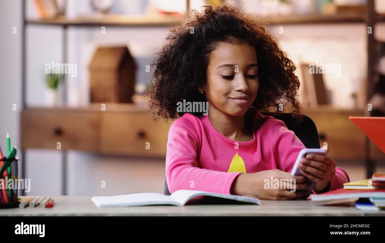 African school girl using phone hi-res stock photography and images - Alamy