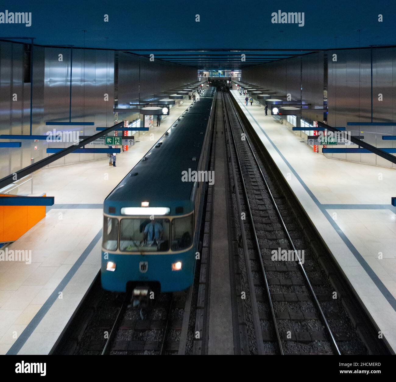 High angle shot of a high-speed blue subway train at the underground ...