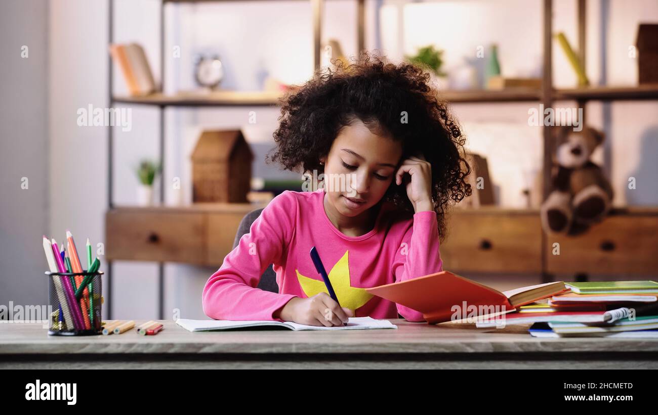smart african american child doing homework Stock Photo - Alamy