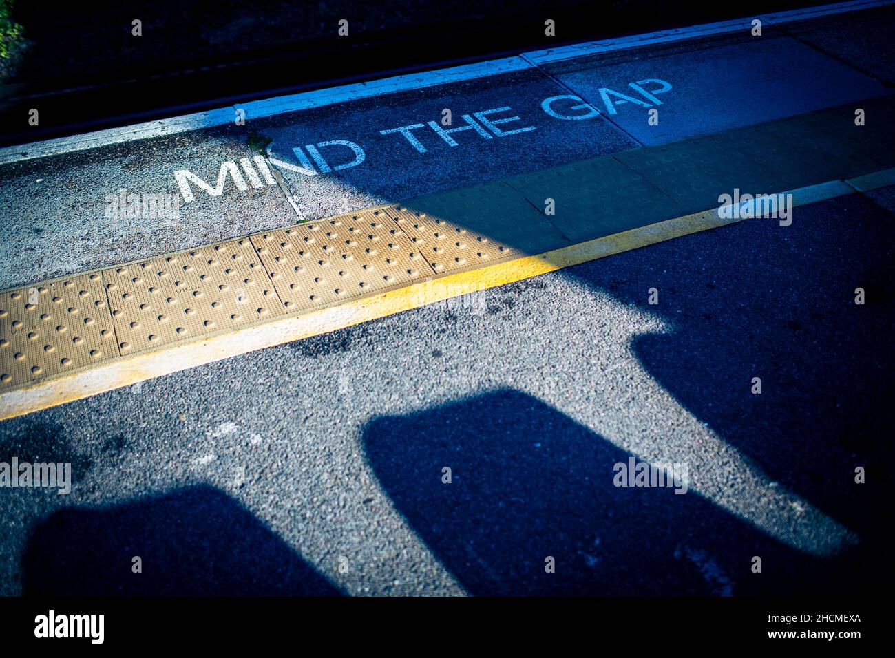 Mind the gap sign at the edge of a railway station platform in Kent ...