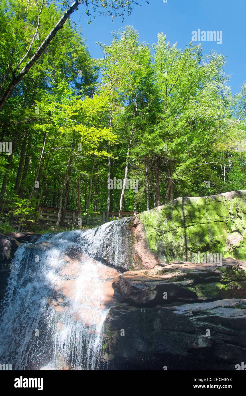 Avalanche falls flowing into flume brook within the steep gorge at the ...