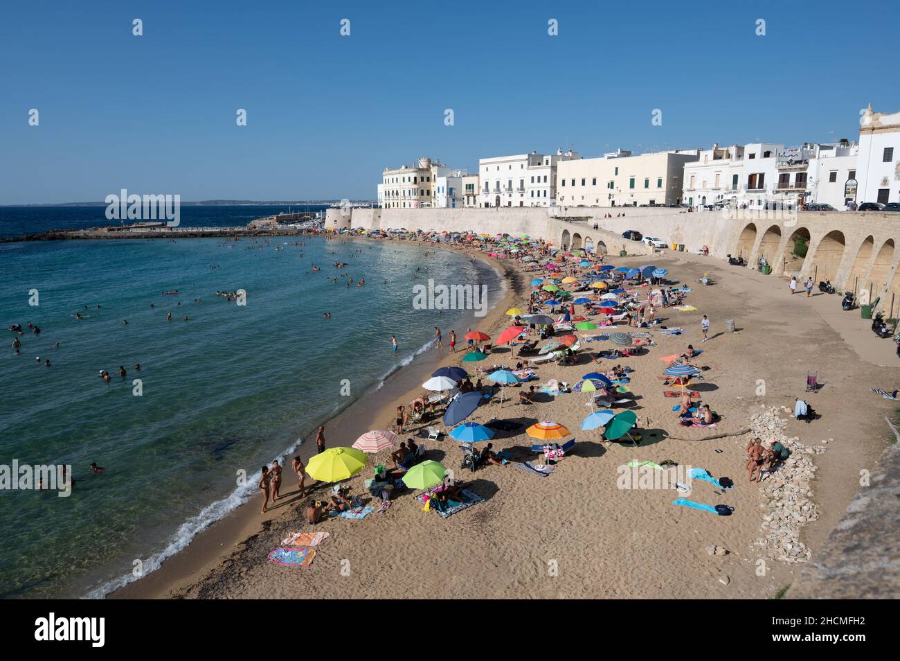 Gallipoli, Puglia, Italy. August 2021. The sandy beach in the old town ...
