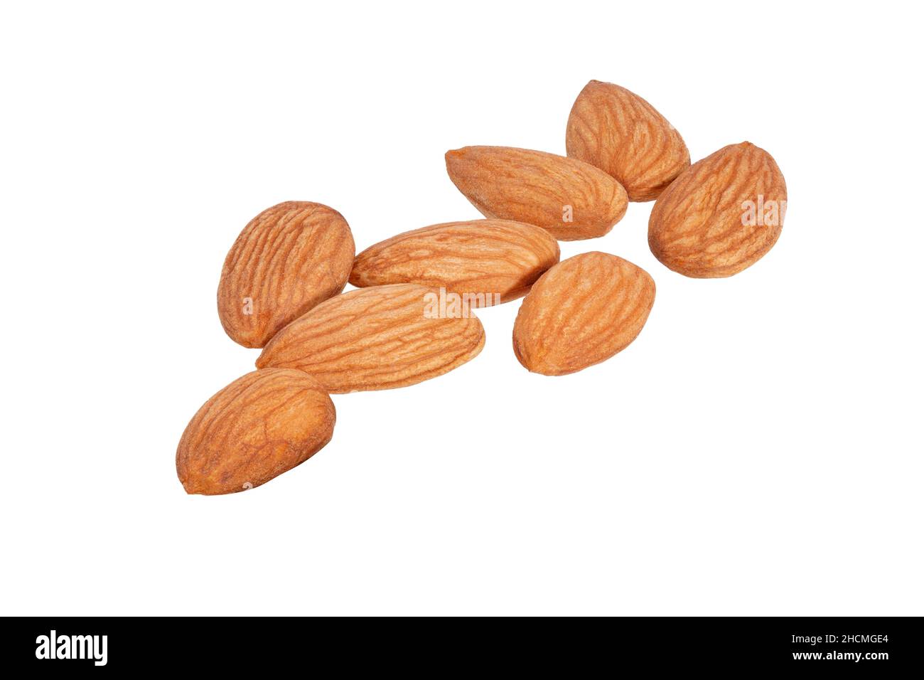 a large pile of almonds isolated on a white background. High quality ...