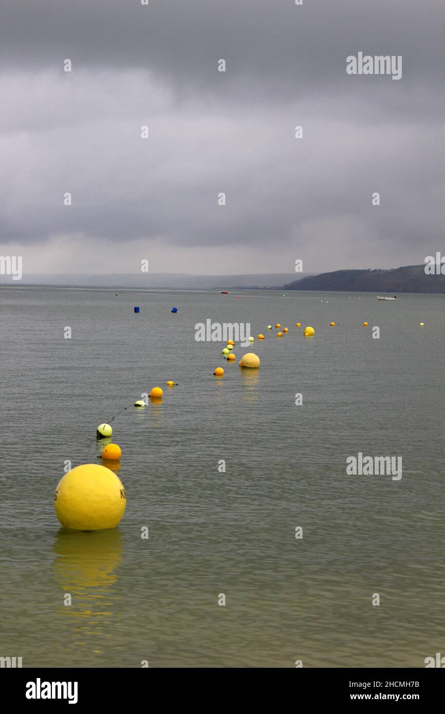 Buoys floating at sea, New Quay, Ceredigion, Wales Stock Photo - Alamy
