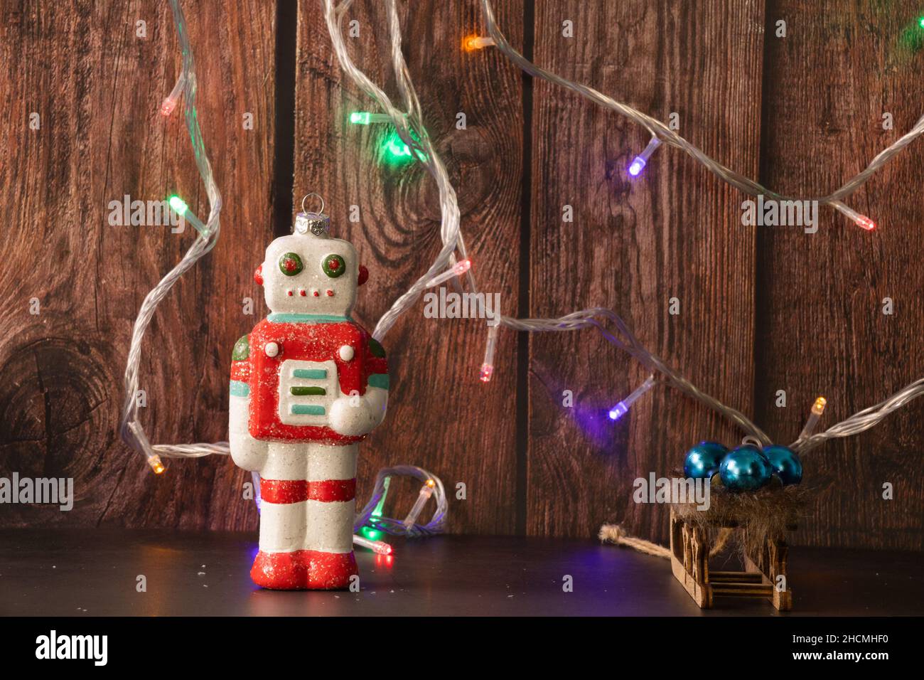 Christmas robot with blue spheres, lights and sleigh Stock Photo - Alamy