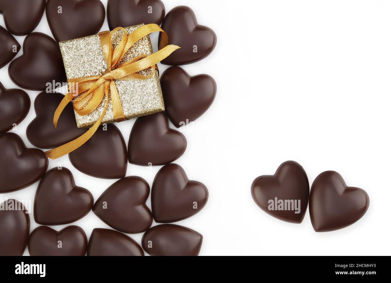 valentines day, heart shaped chocolates with wrapped glittering golden ...