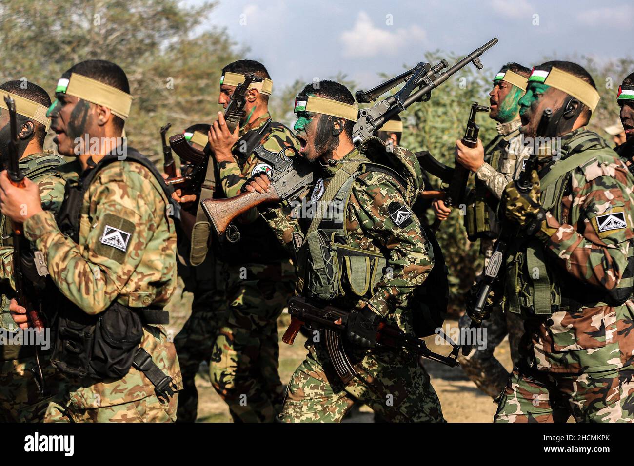 Gaza, Palestine. 29th Dec, 2021. Palestinian fighters carry weapons ...