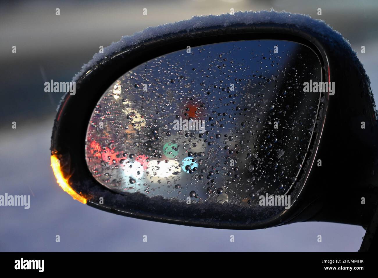 Winter car, the concept of winter car ride. Mirror and ice and water ...