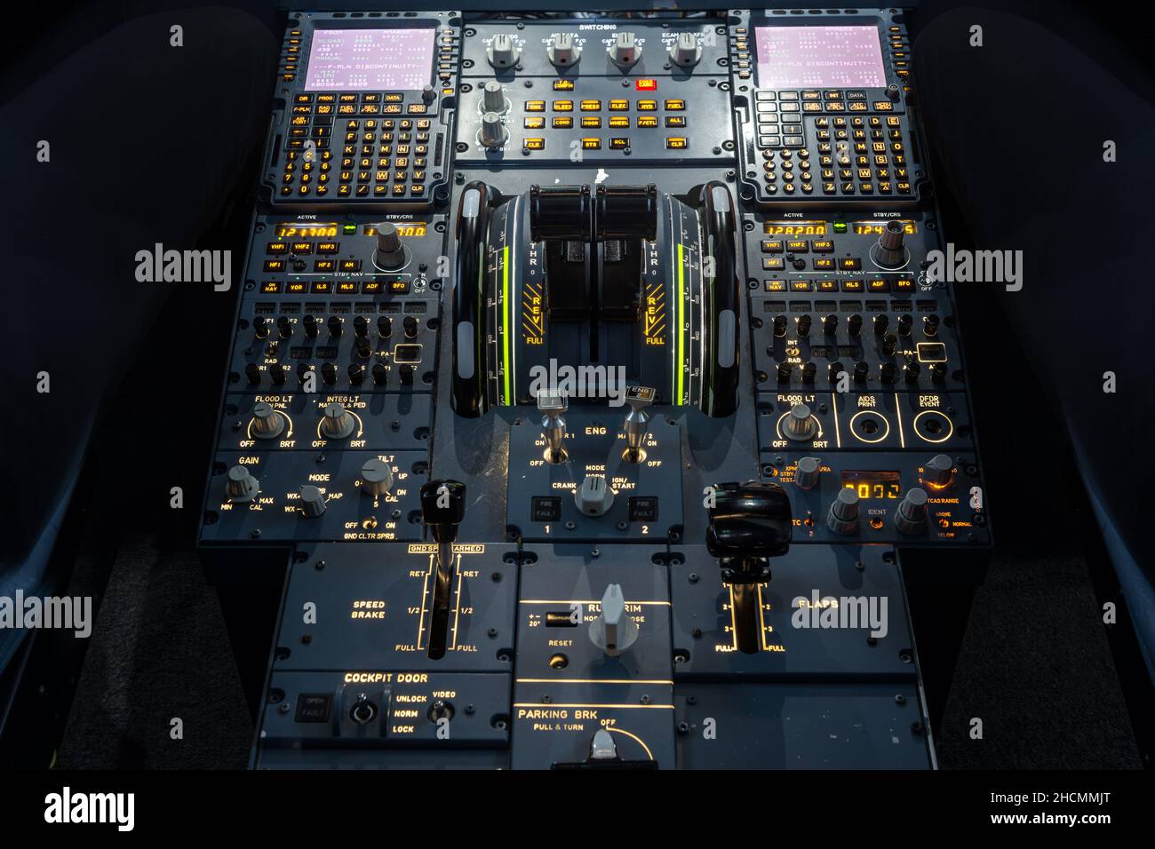 Engines thrust levers and centram control panel inside a big jet plane ...