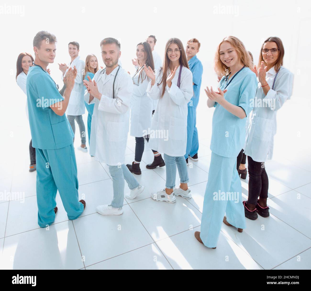 team of diverse doctors applauding their joint success Stock Photo - Alamy
